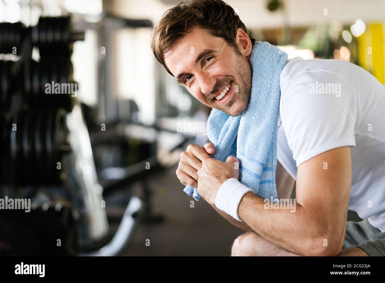 Lifestyle portrait of handsome muscular man after the training in the ...
