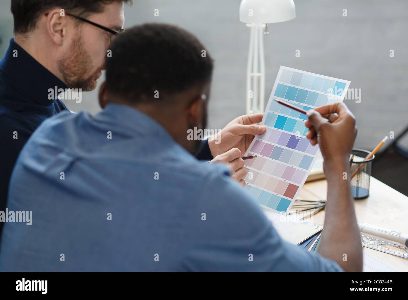Multiracial engineer team working in office with color palette ...