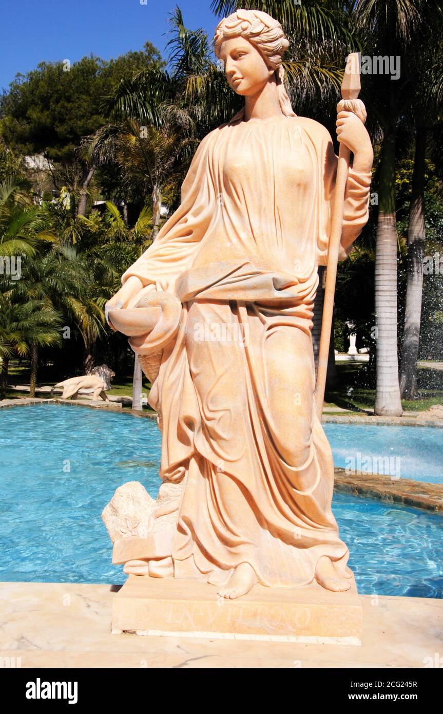 Winter statue with fountain, pool and mill to the rear, Molina de Inca ...