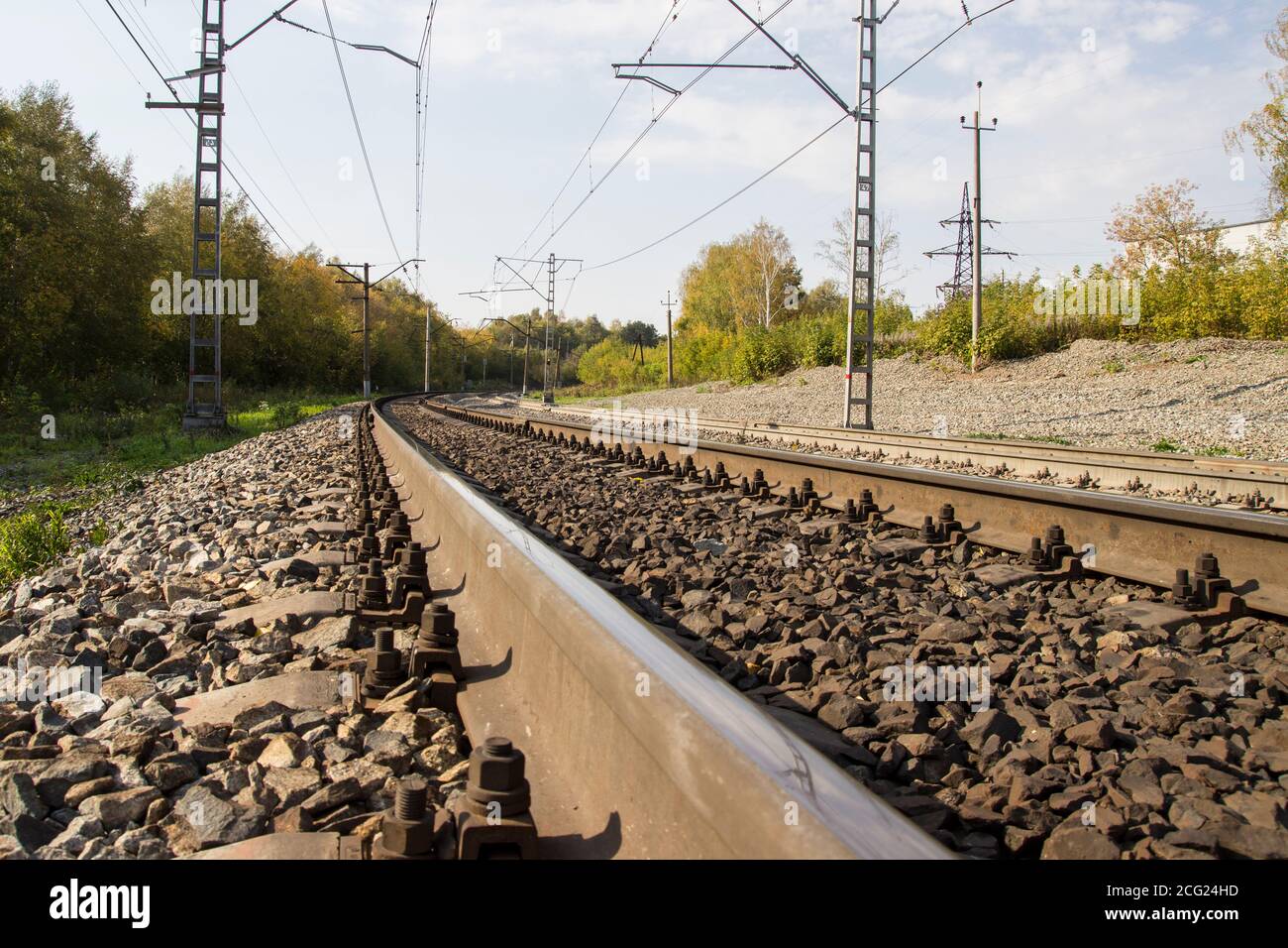 Railroad track, railway landscape. Metal sleepers on the railway. Low ...