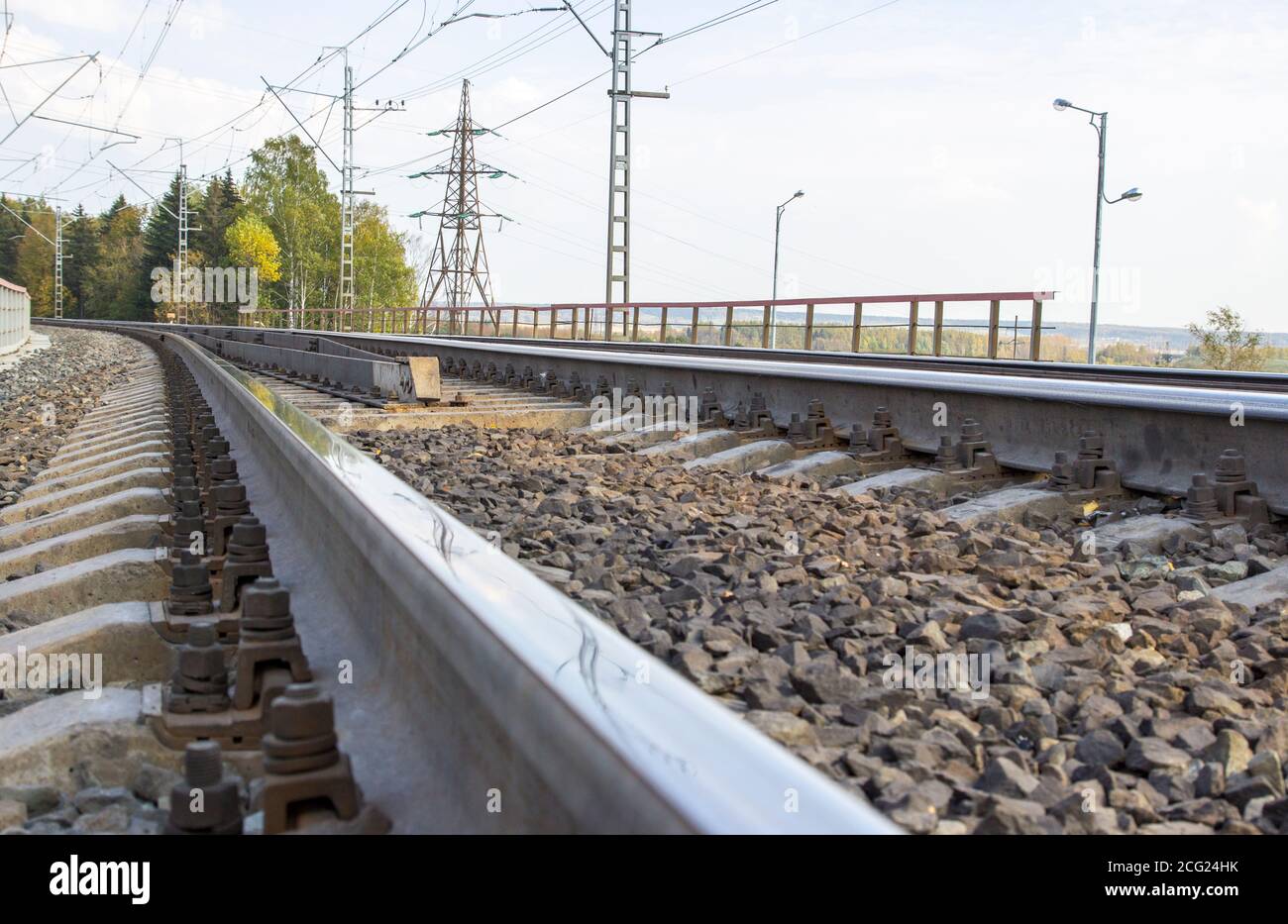 Railroad track, railway landscape. Metal sleepers on the railway. Low ...