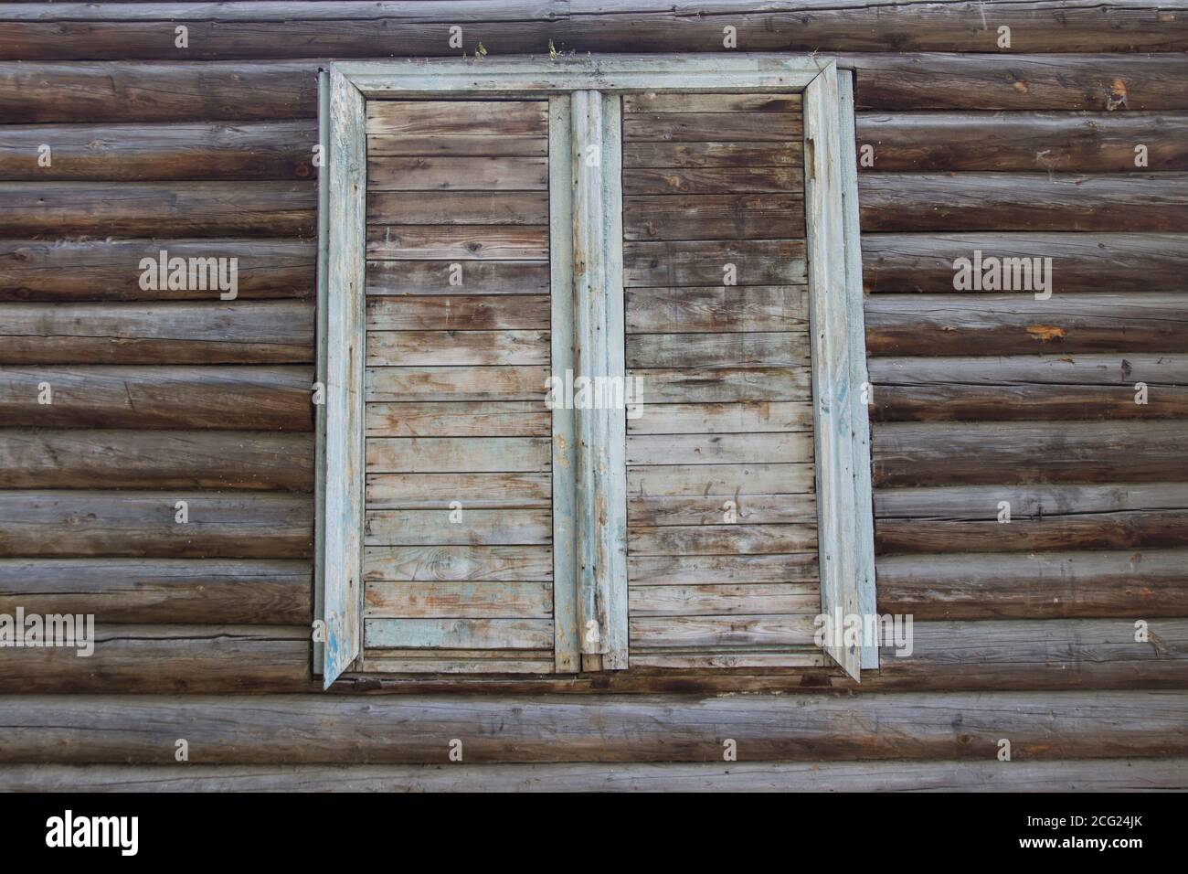 Old house with boarded up window. Boarded-up windows of an old building ...