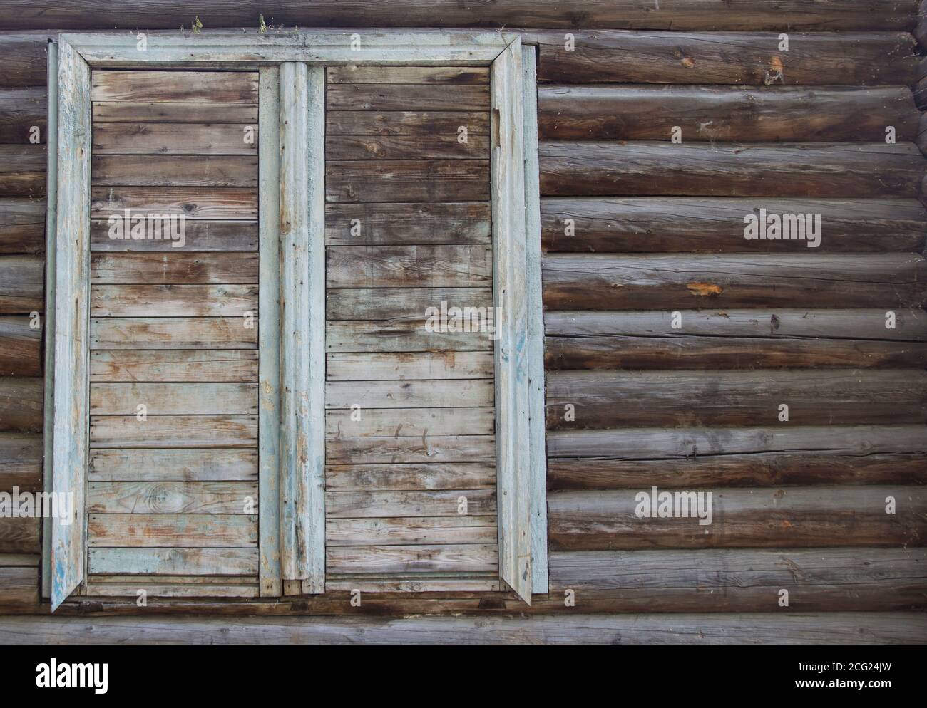 Old house with boarded up window. Boarded-up windows of an old building ...
