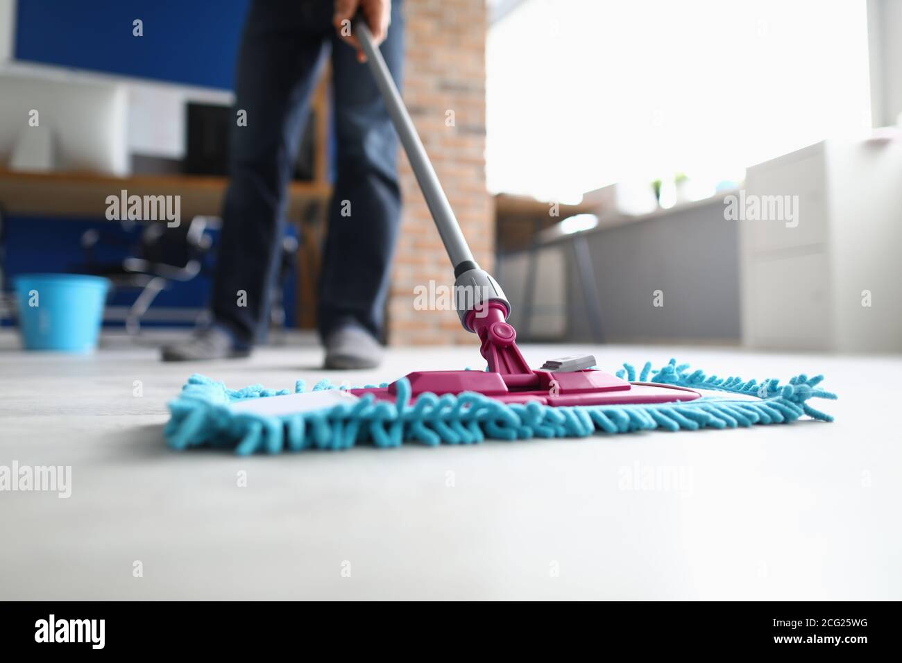 Janitor mopping office hi-res stock photography and images - Alamy