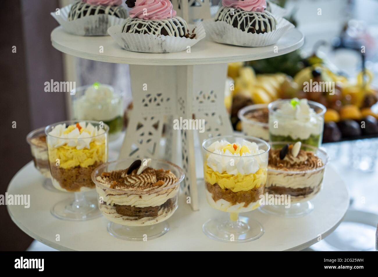 Wedding sweets, decorated tables, decorations and cupcakes, delicious ...