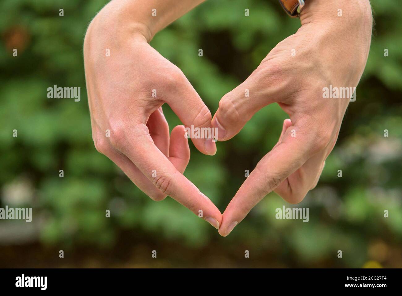 Two hands form heart shape hi-res stock photography and images - Alamy