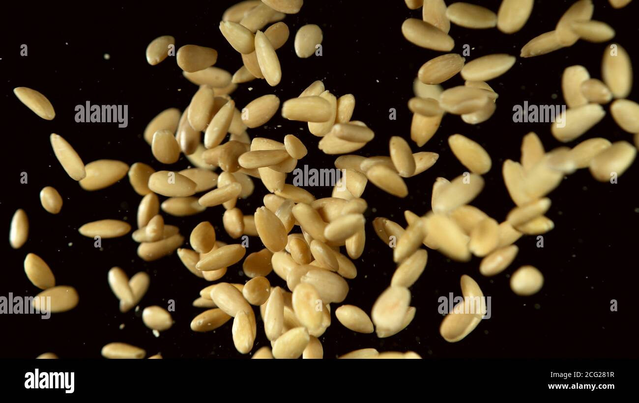 Realistic freeze motion of flying almonds on black background Stock ...