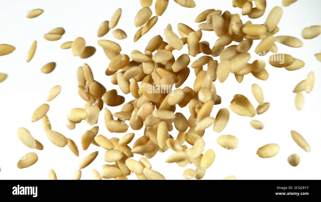 Realistic freeze motion of flying almonds on white background Stock ...