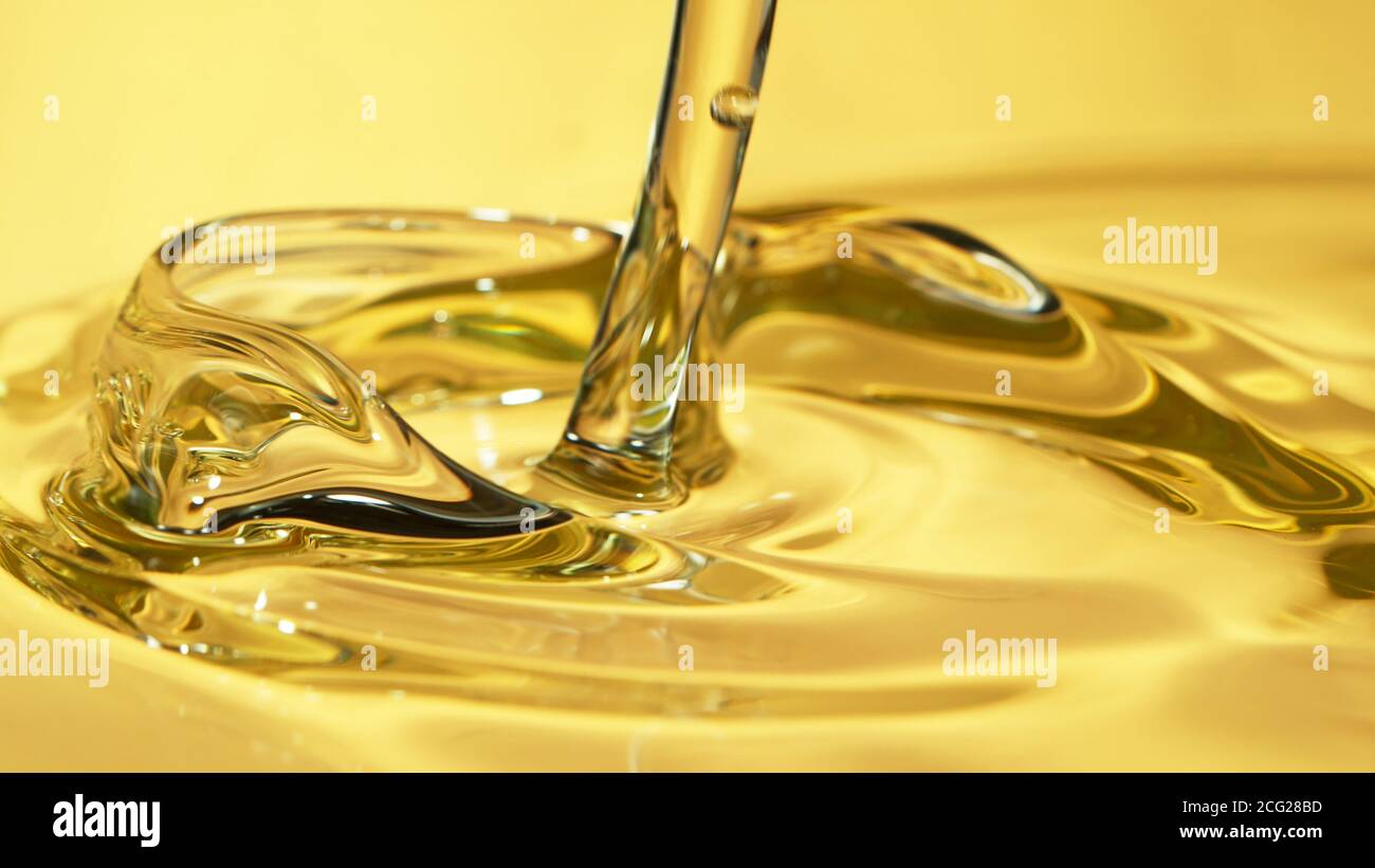 Freeze motion of pouring oil, super macro shot Stock Photo - Alamy