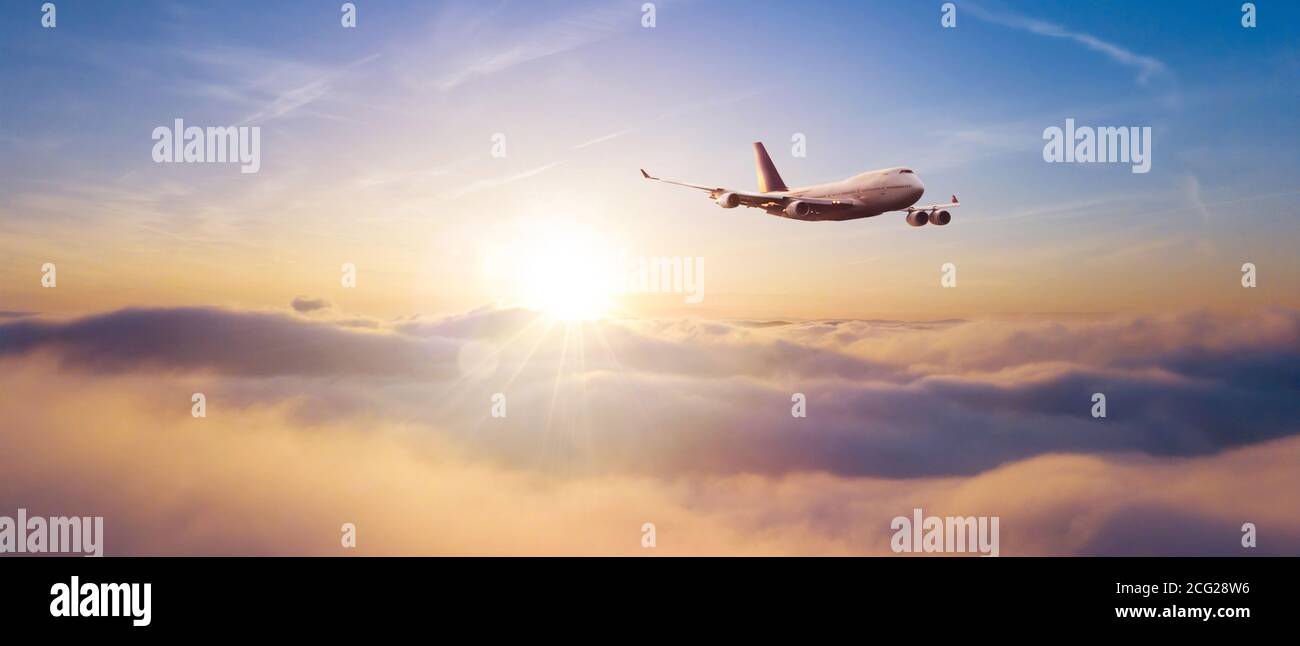Huge commercial airplane flying over dramatic sunset sky. Jet plane is ...