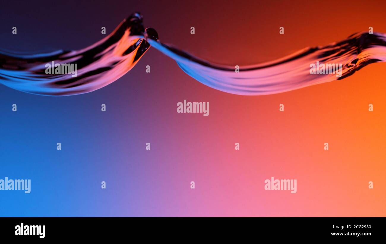 Detail of water waves highlighted by neon lights. Abstract water ...