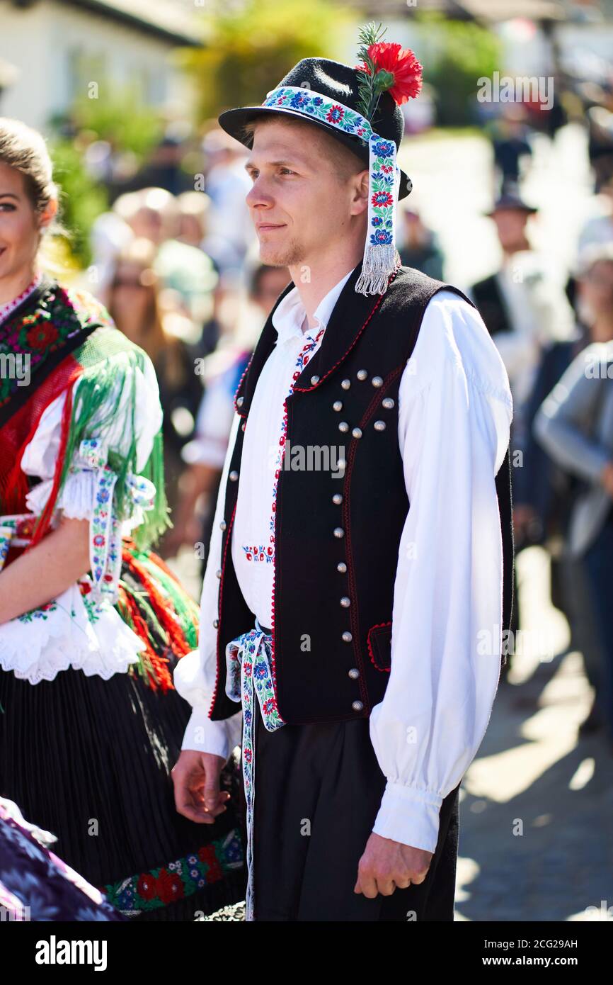 Portrait of a young man dressed in a traditional folk costume in ...