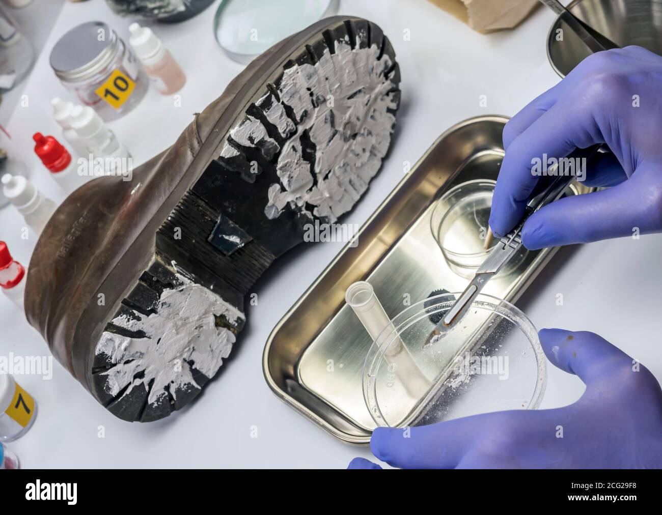 Shoe with cement footprints analyzed in crime lab, crime evidence ...