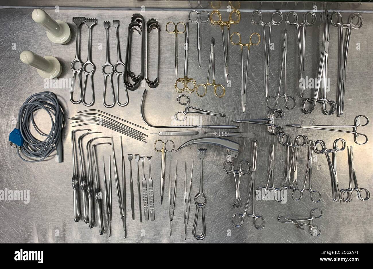 Surgical instruments lie sorted next to each other on an operating ...