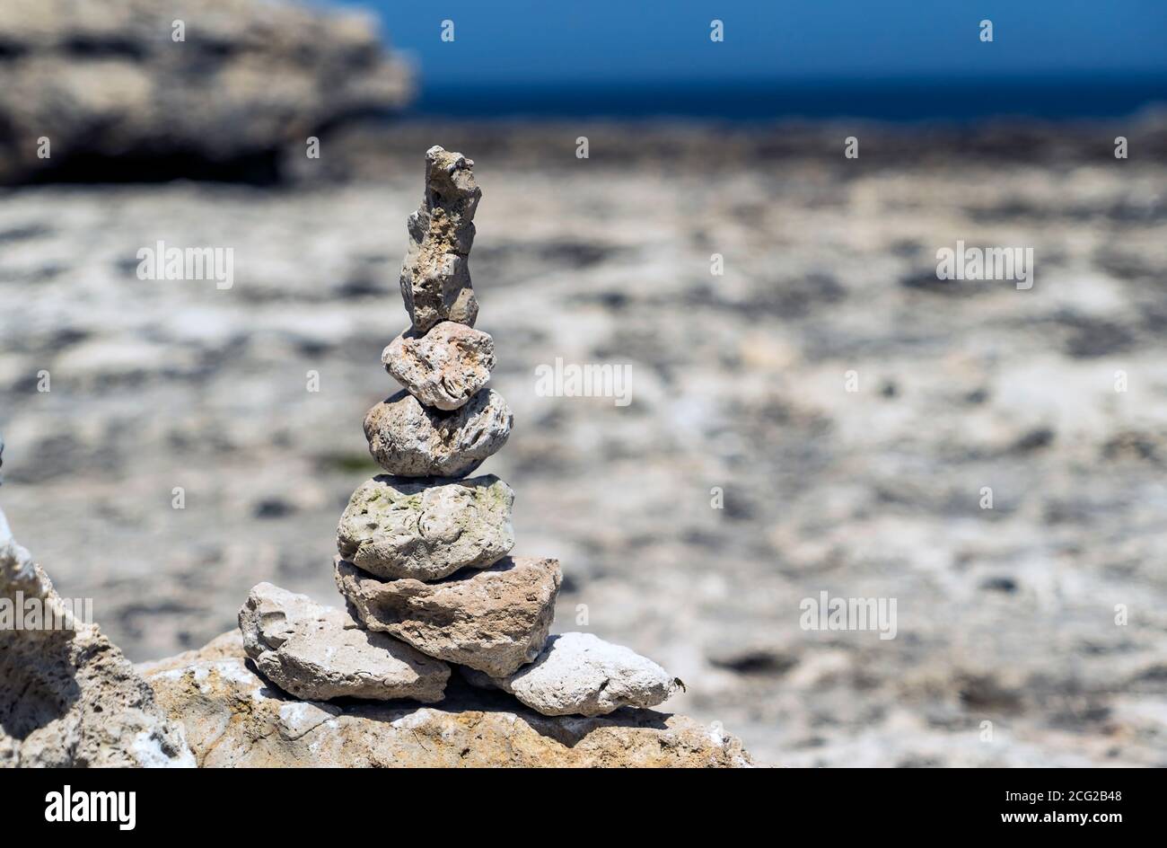 Pyramid of stones on the stone shore of the black sea . Crimea Stock ...