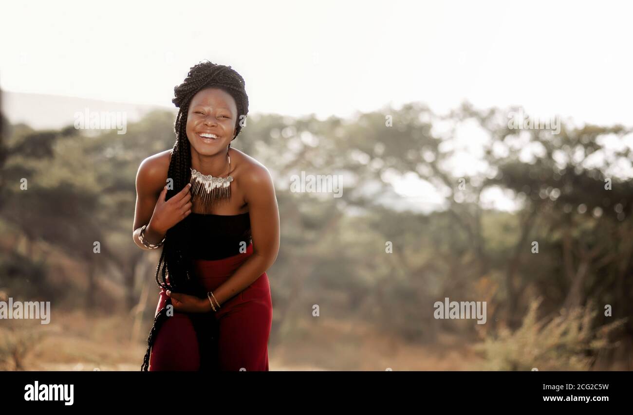 successful black woman model in african safari with african jewellery ...