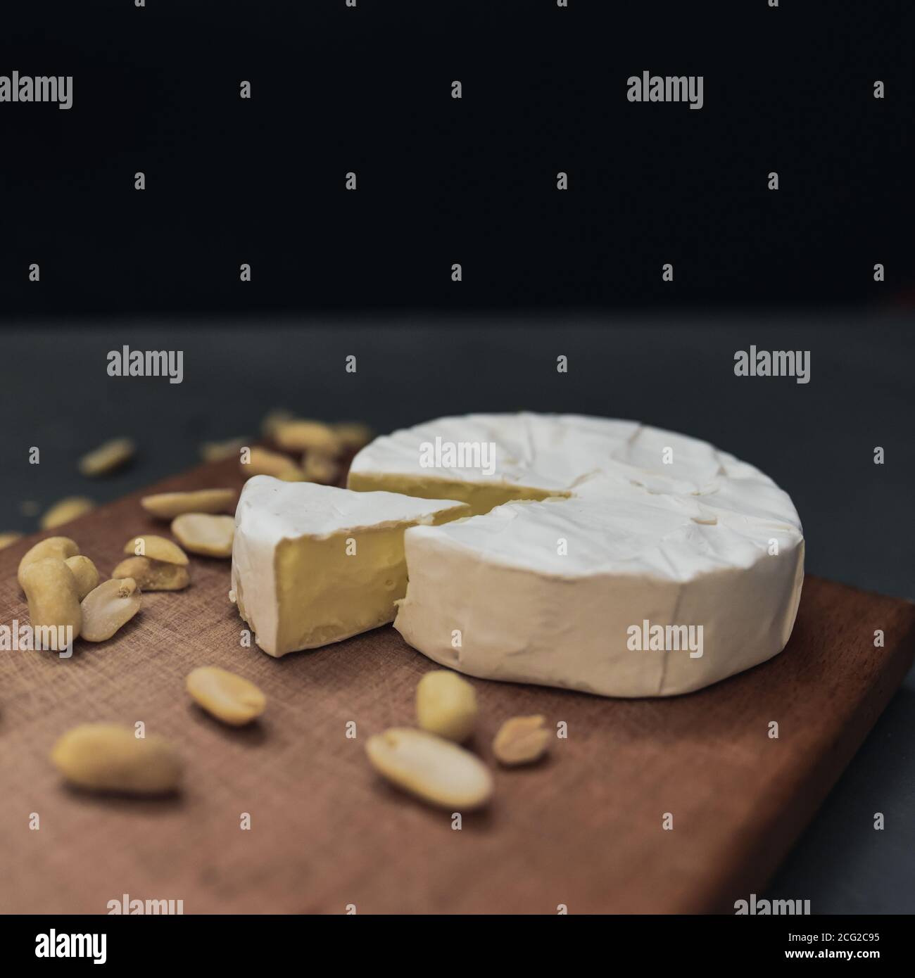 cheese camembert with mold and nuts on wooden board Stock Photo - Alamy
