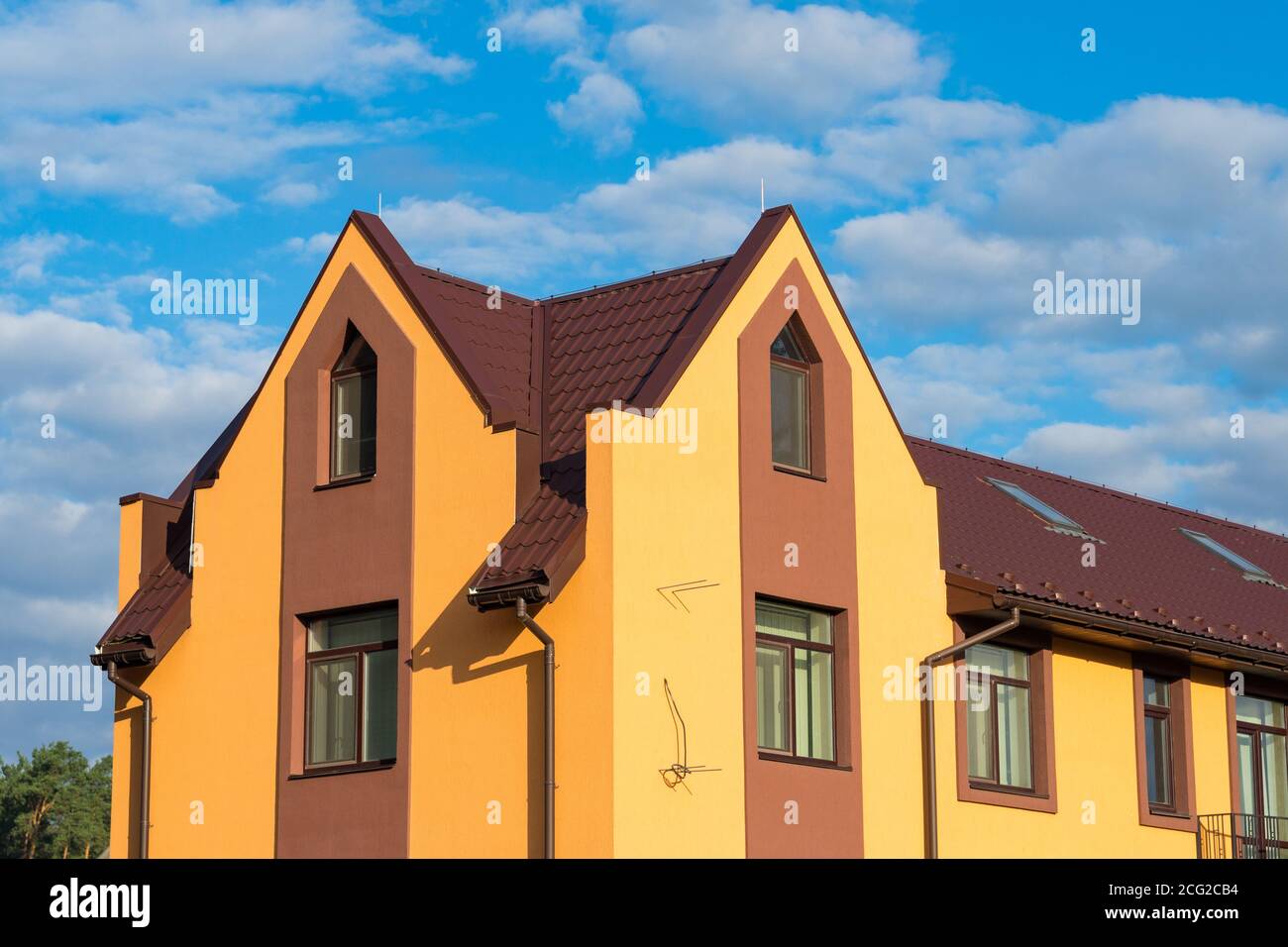 Frame house under construction with a rain gutter system on a metal ...