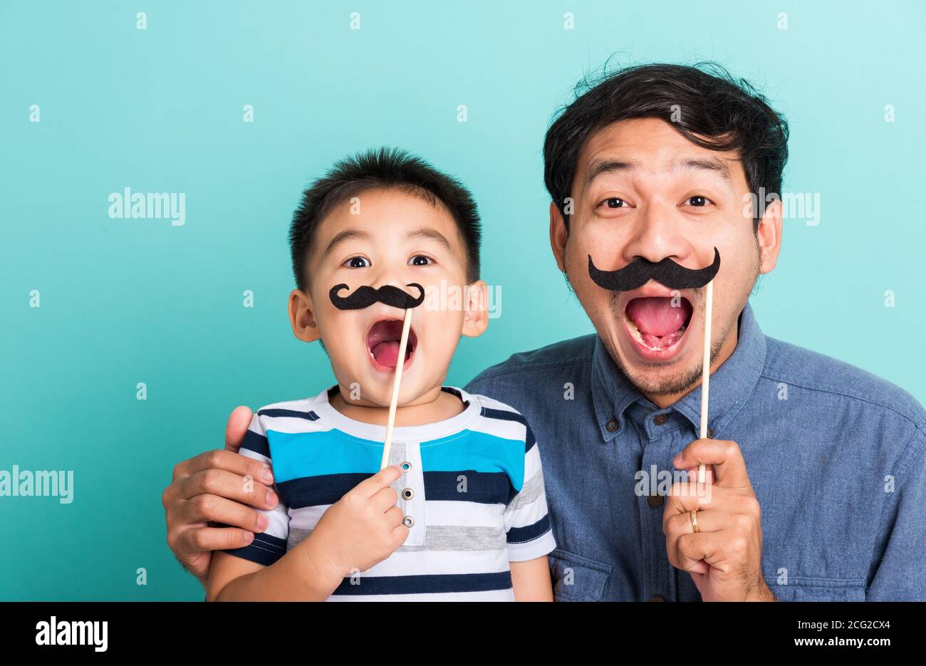 Family funny happy hipster father and his son kid holding black ...