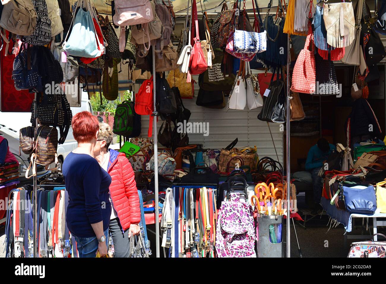 people shopping at street market colorful bags Stock Photo - Alamy