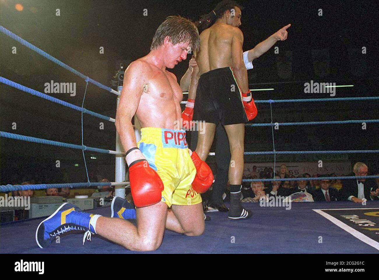 An exhausted Nicky Piper slumps to the canvas during a fight with Crawford Ashley in Cardiff ...