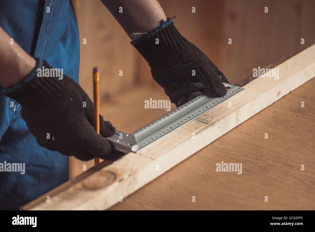 Man drawing line with pencil and holding raw as ruler. House improving ...