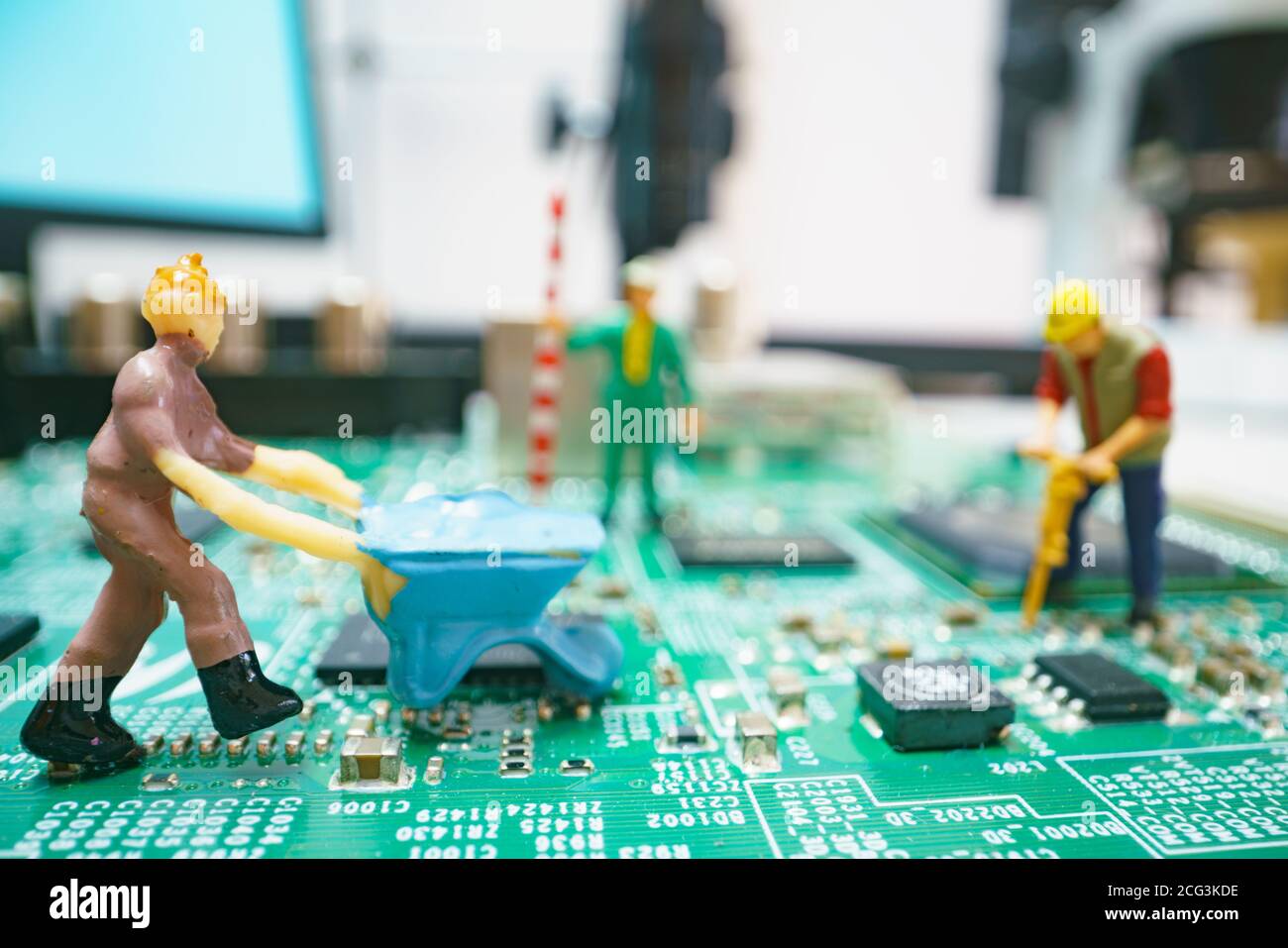 Miniature repair man on mainboard, Miniature figure of worker team try ...