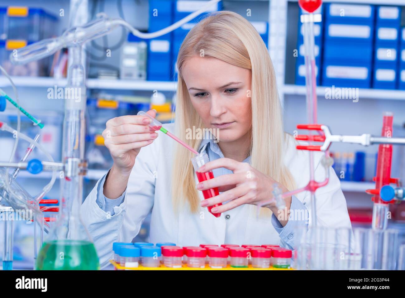 Girl laboratory Assistant works with an antiviral drug in a ...