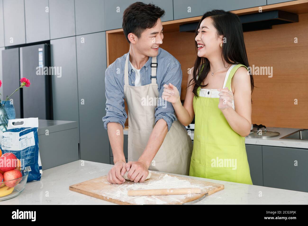 Happy couples of cooking in the kitchen Stock Photo - Alamy