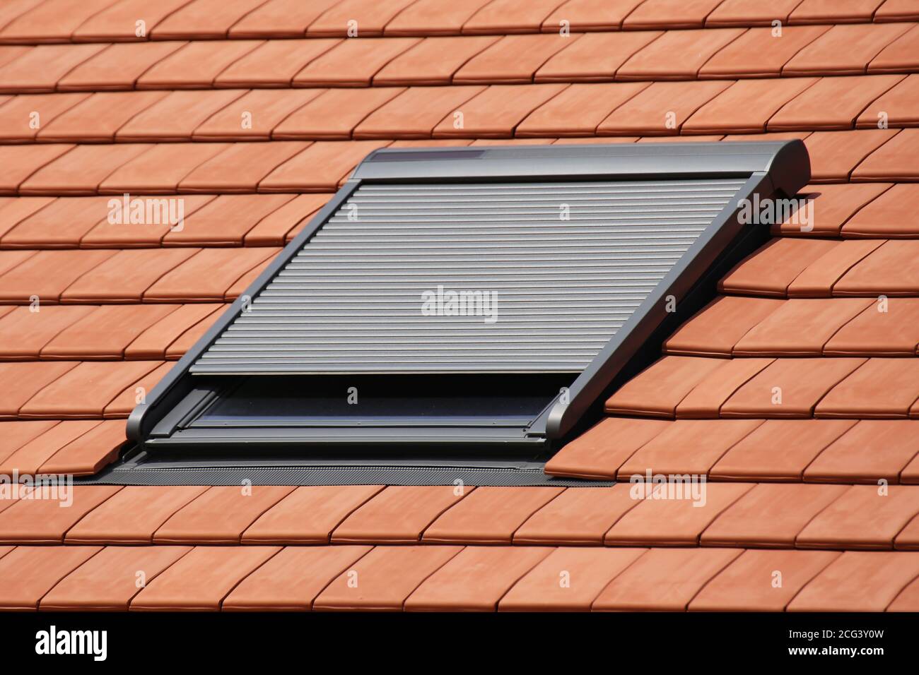 Roof window with roller shutter Stock Photo - Alamy