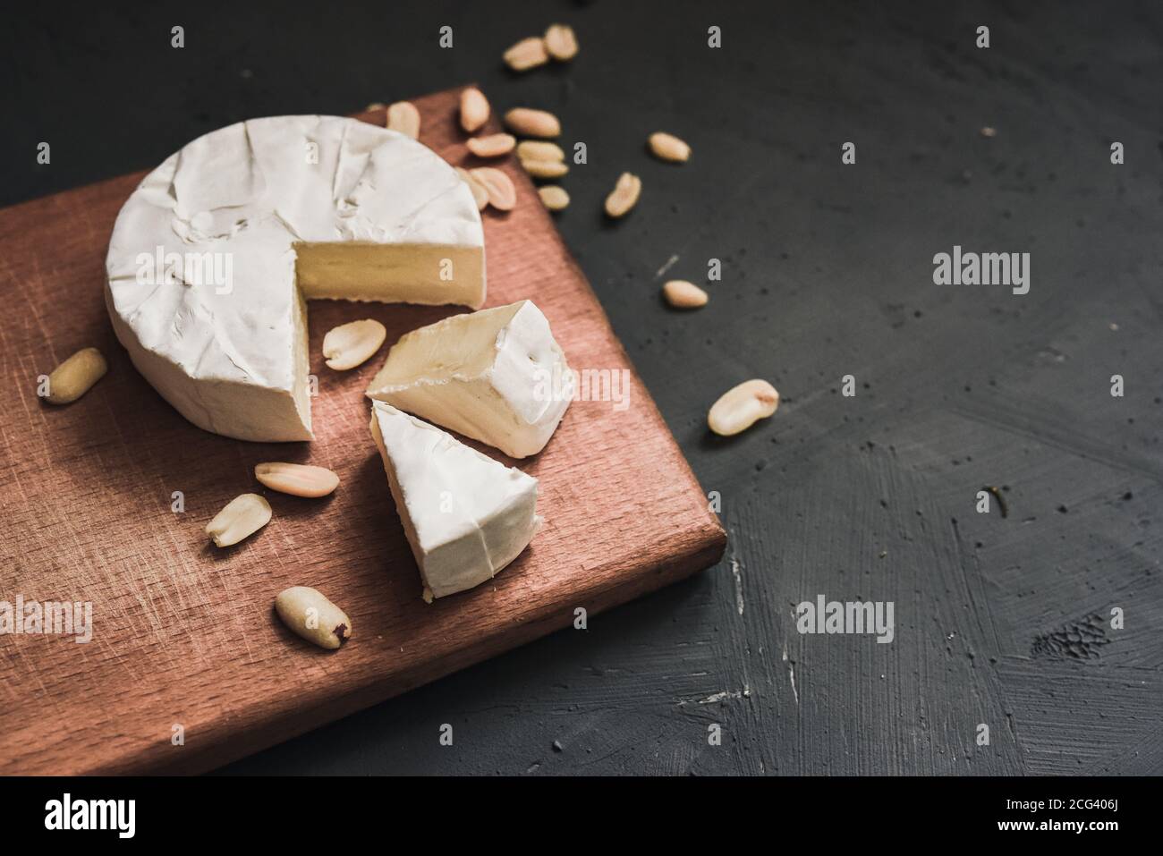 cheese camembert with mold and nuts on wooden board Stock Photo - Alamy