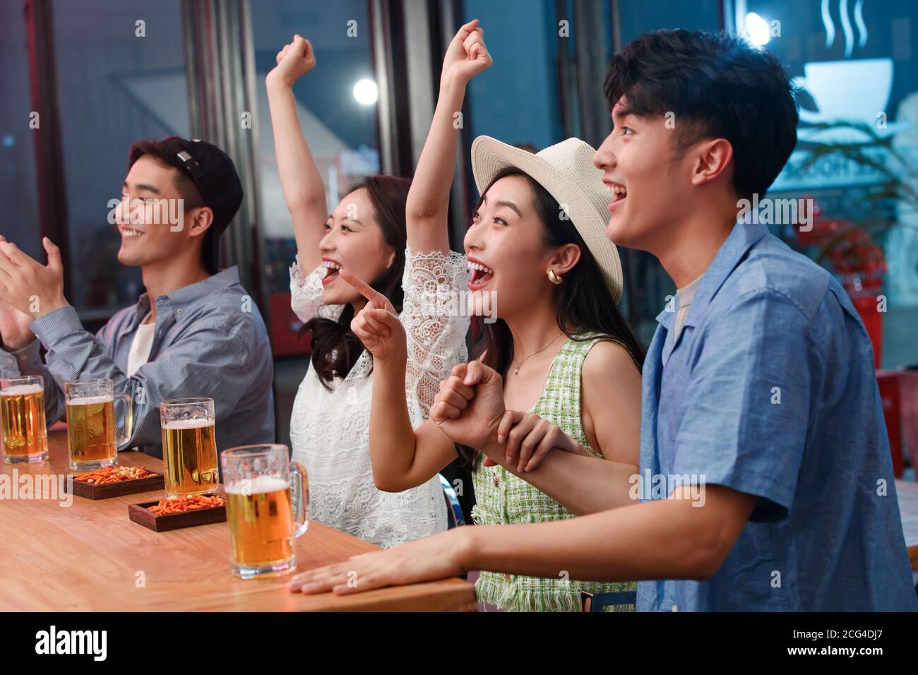 Nightlife bar couple watching hi-res stock photography and images - Alamy