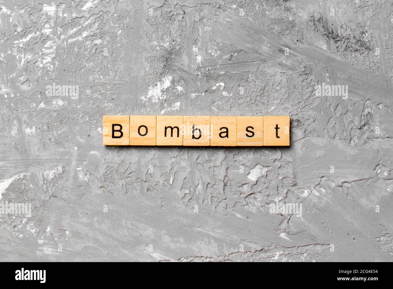 bombast word written on wood block. bombast text on cement table for ...