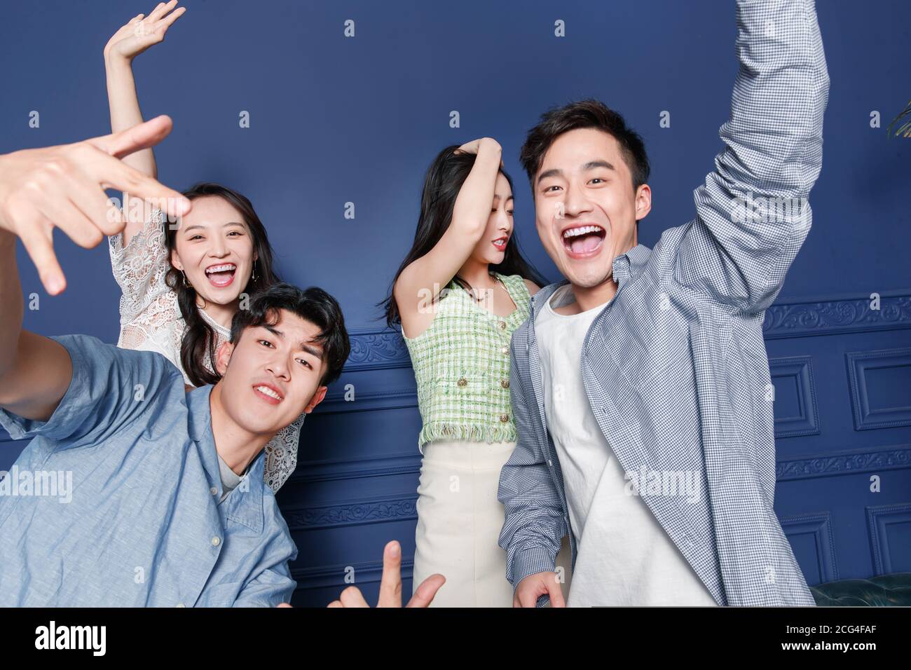 Happy young friends to play together Stock Photo - Alamy