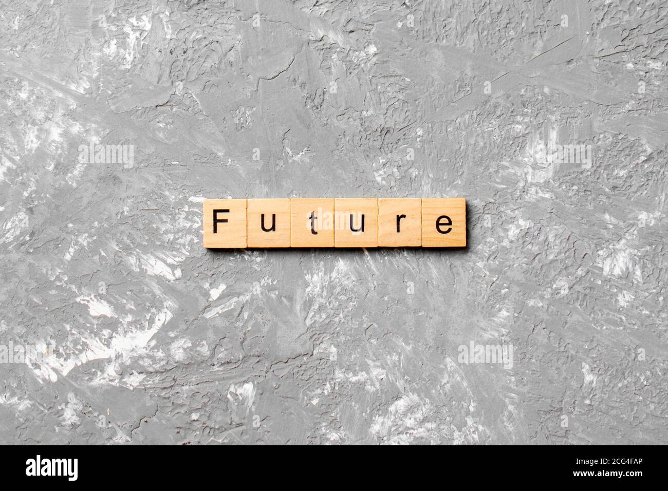 Future word written on wood block. Future text on cement table for your ...