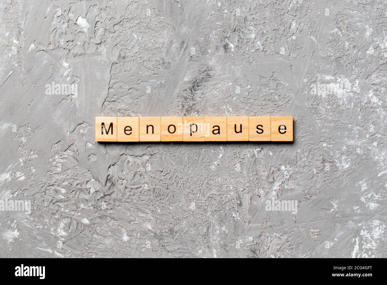 menopause word written on wood block. menopause text on table, concept ...