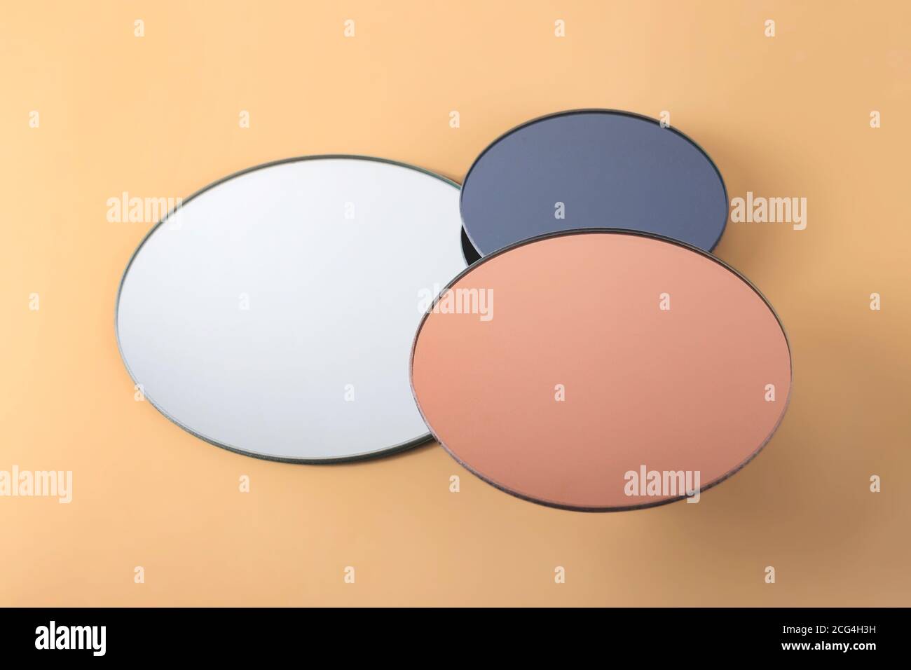 Three round stands for objects with mirrored surfaces Stock Photo - Alamy