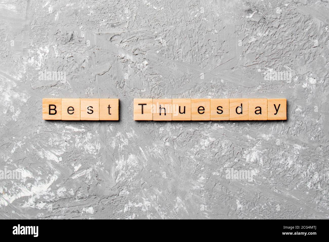 best Tuesday word written on wood block. best Tuesday text on cement ...