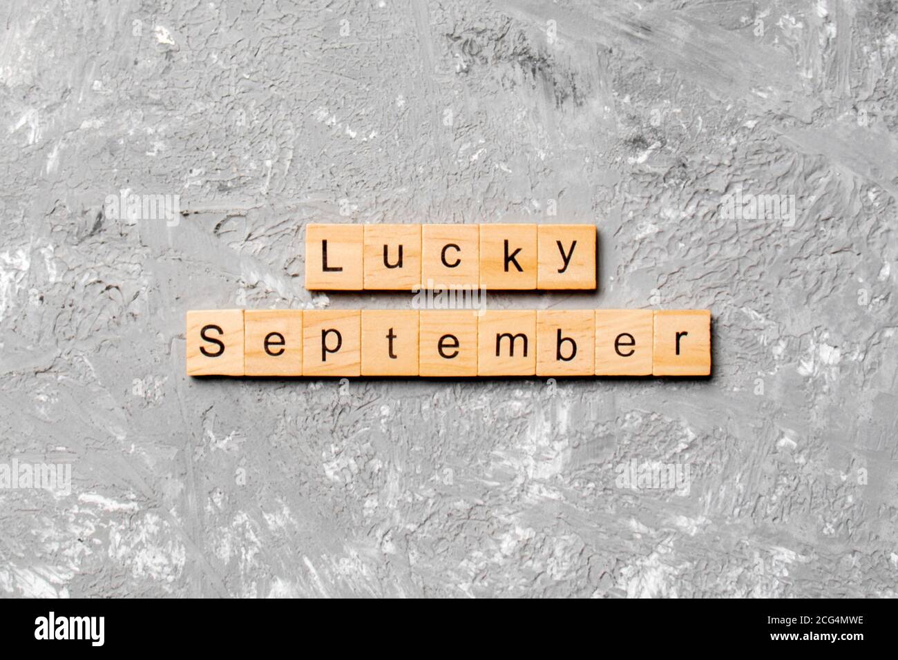 lucky september word written on wood block. lucky september text on ...