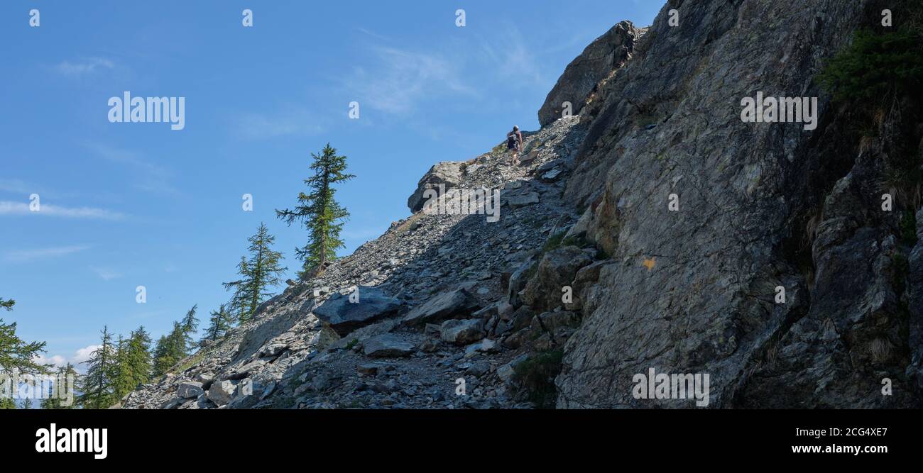 alone woman along path in mountain - girl hiking Stock Photo - Alamy