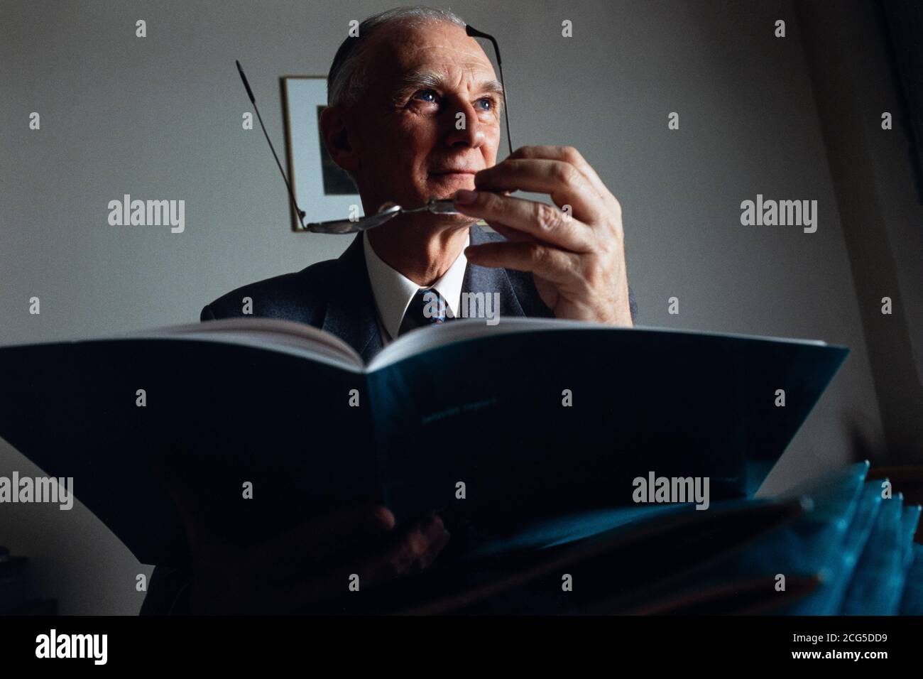 Sir Ron Dearing with the first draft copies of his NCC interim report ...