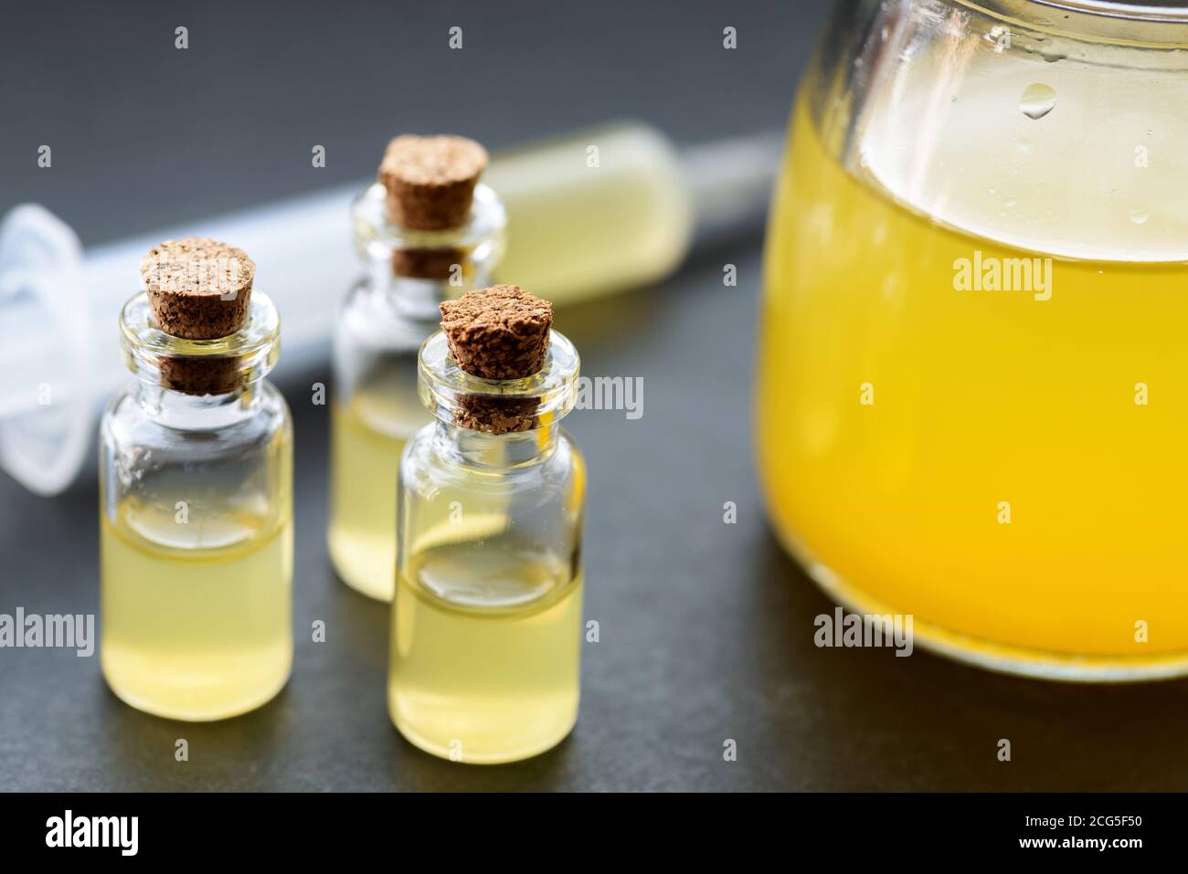 Orange colored liquid in a bottle. Concept Stock Photo - Alamy