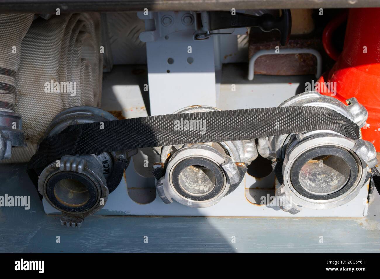 hose adapters mounted in the fire truck compartment Stock Photo - Alamy