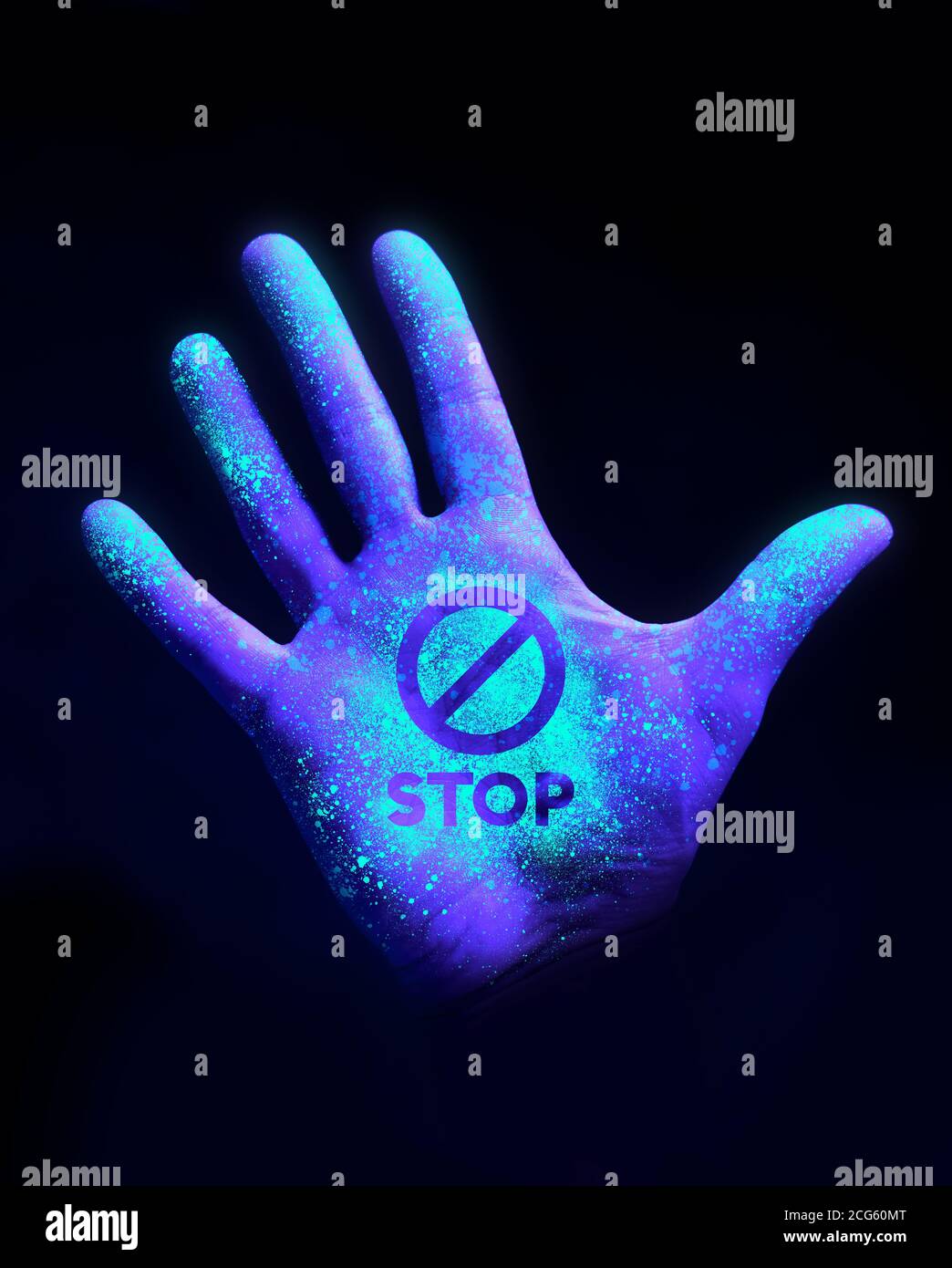 Stop the spread of desease. A human hand glowing from UV ultra violet ...