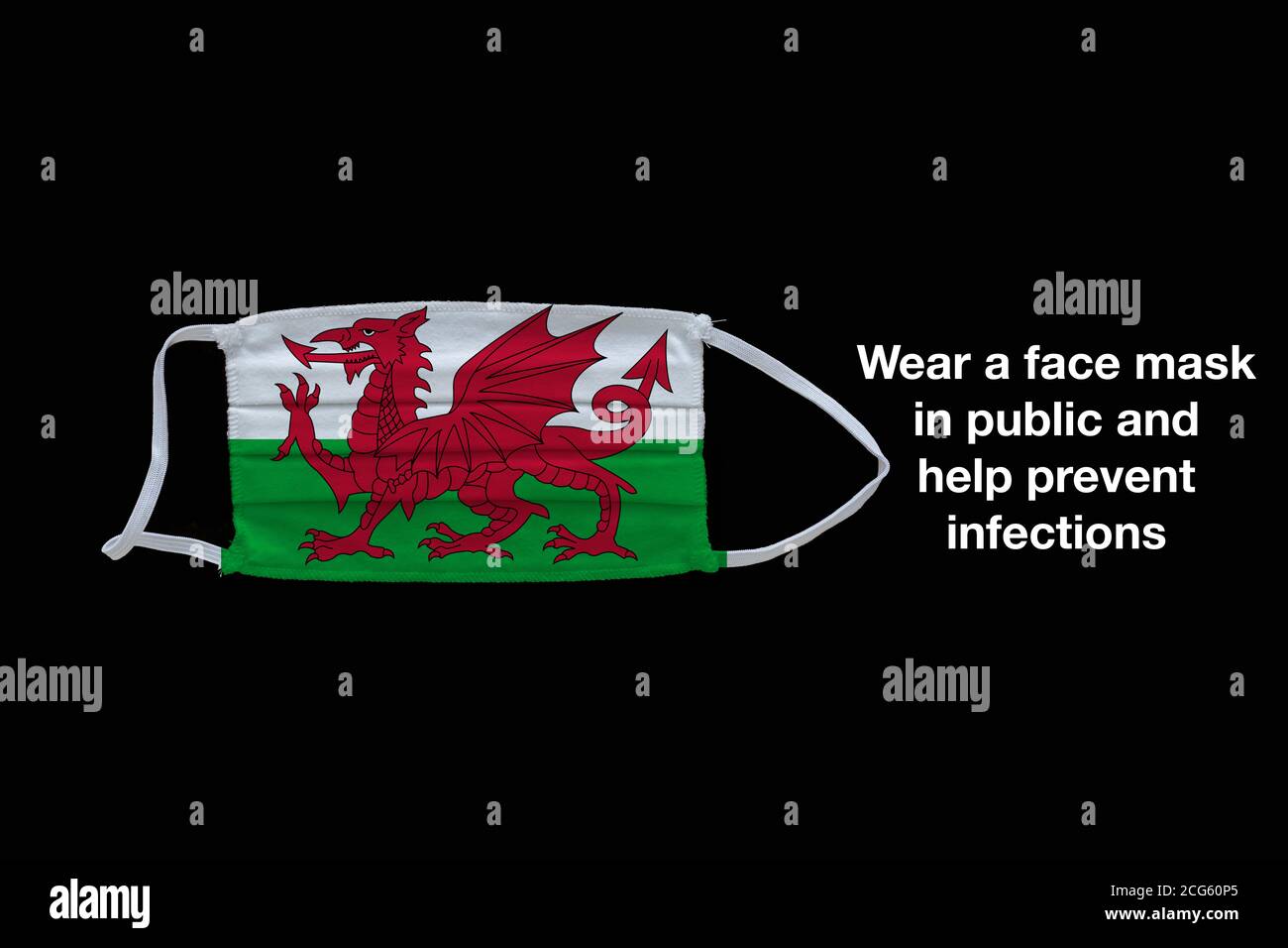 Welsh flag design Covid-19 face mask and information message on a black ...