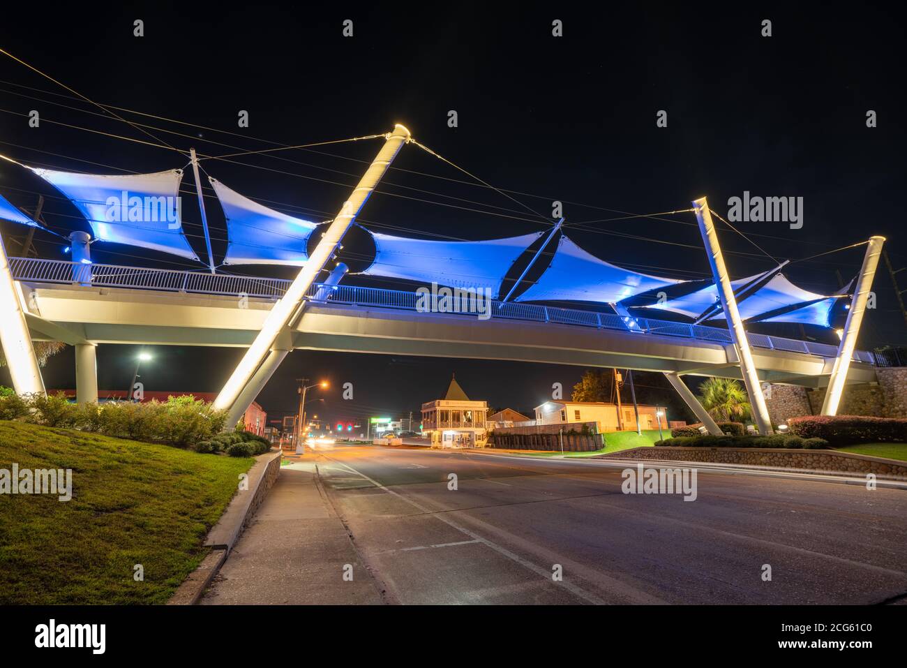 Night photo of the South Monroe pedestrian Bridge lit neon blue Stock ...