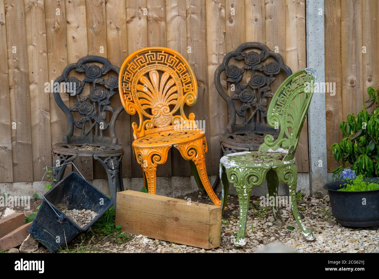 Old abandoned multi colored outside metal dining patio chairs Stock ...
