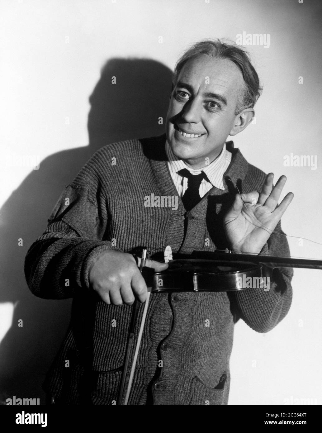 Actor Alec Guinness dressed as his character 'Professor Marcus from the ...