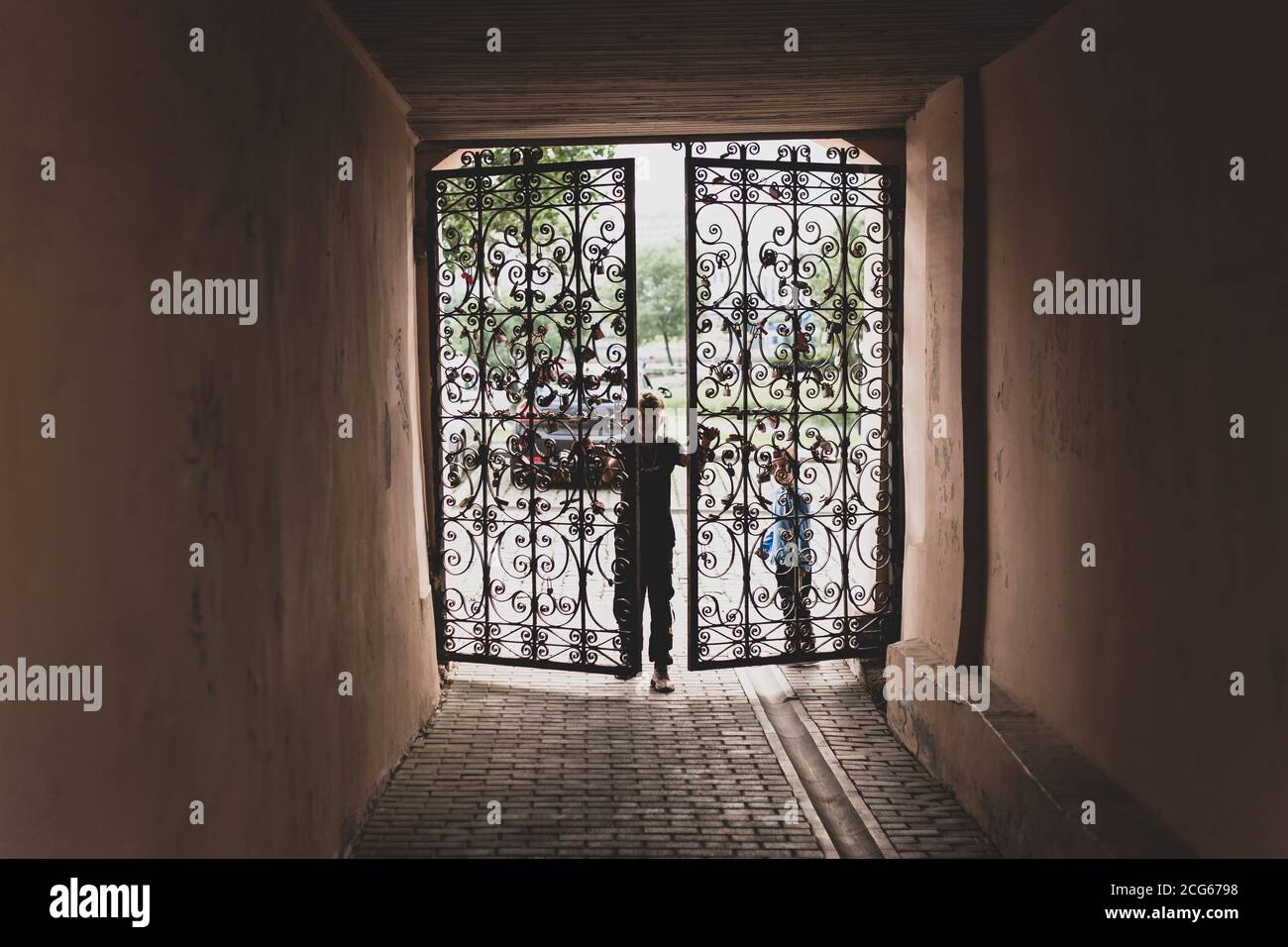 Two boys stand outside the gate Stock Photo - Alamy