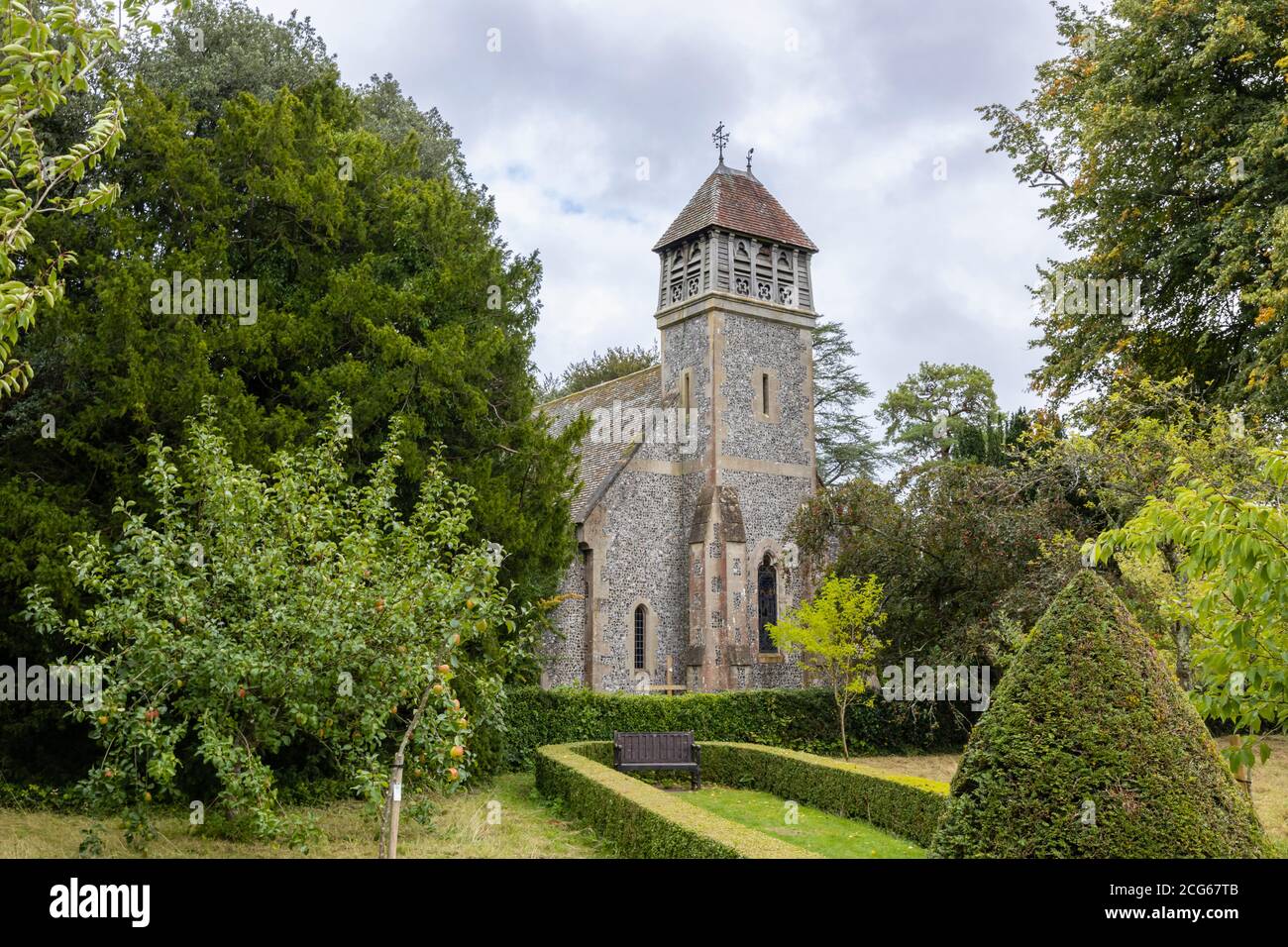 Flint walled parish church of All Saints and timber bell chamber ...